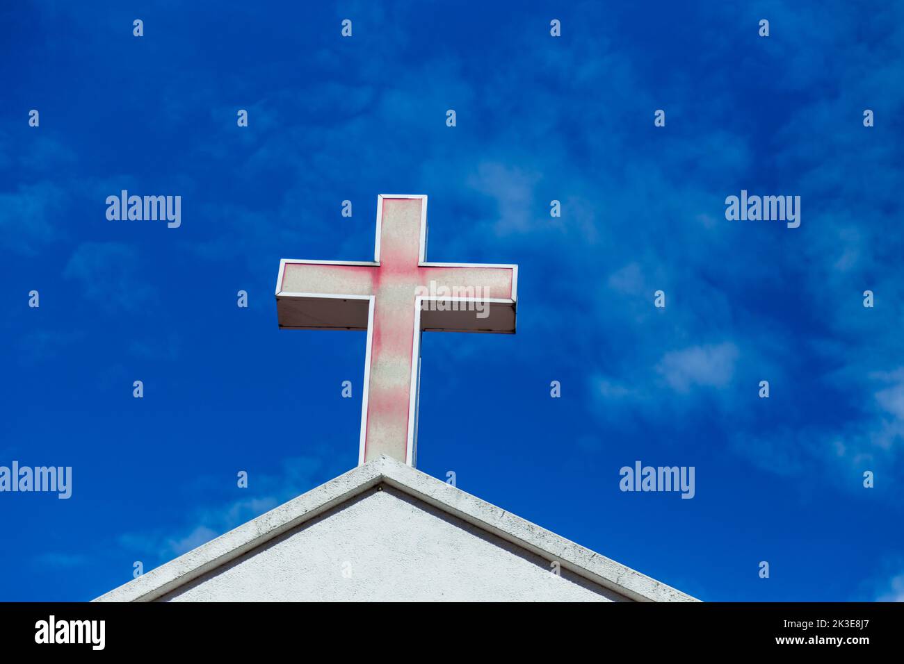 Faded red cross on church roof Stock Photo - Alamy
