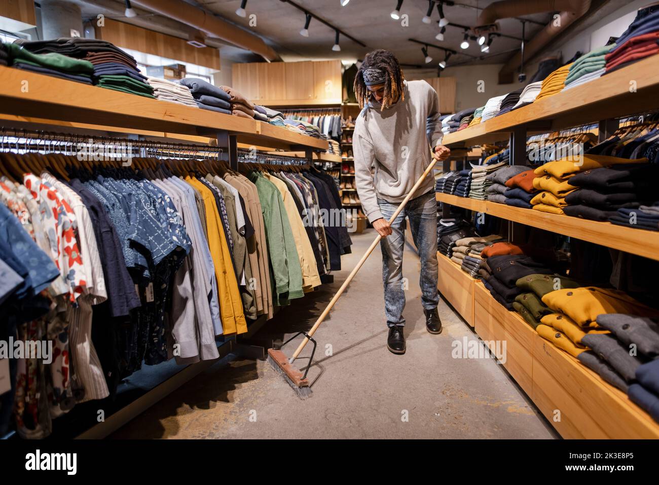 Male sweeping floor hi-res stock photography and images - Alamy