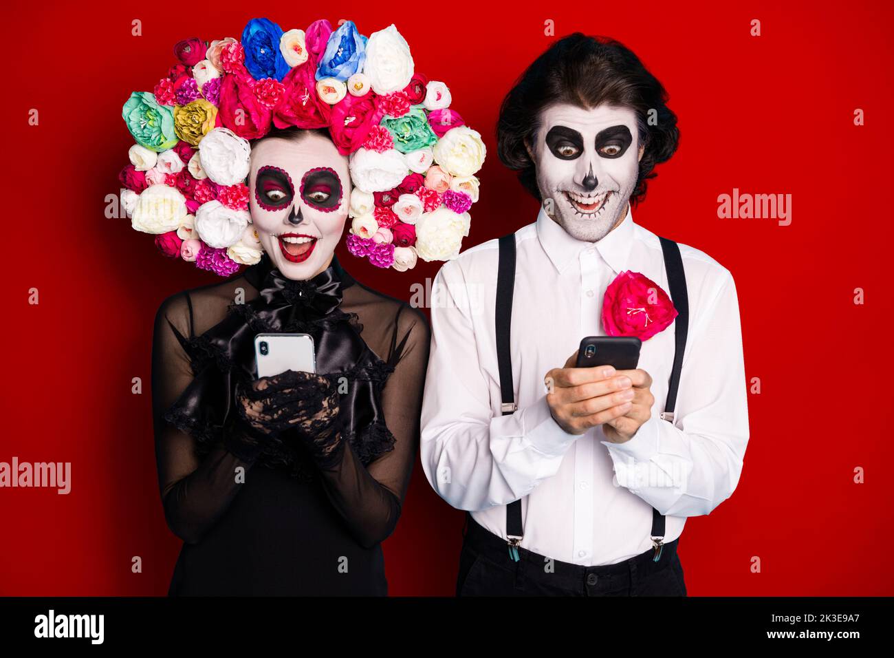 Photo of creepy zombie two people man lady hold telephones excited find ...