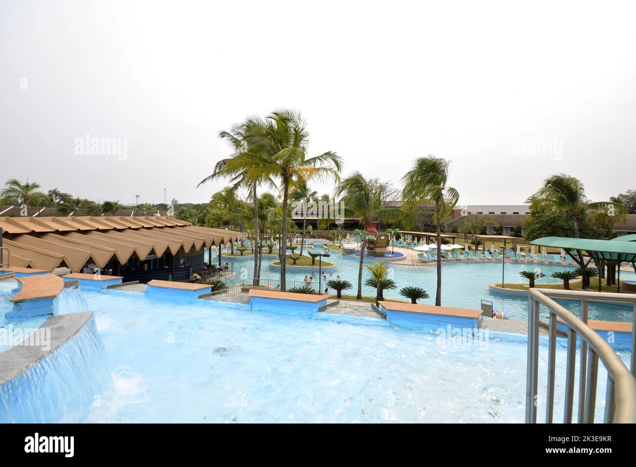 Tourists at Swimming Pools of a Luxury Resort with Waterfall and ...