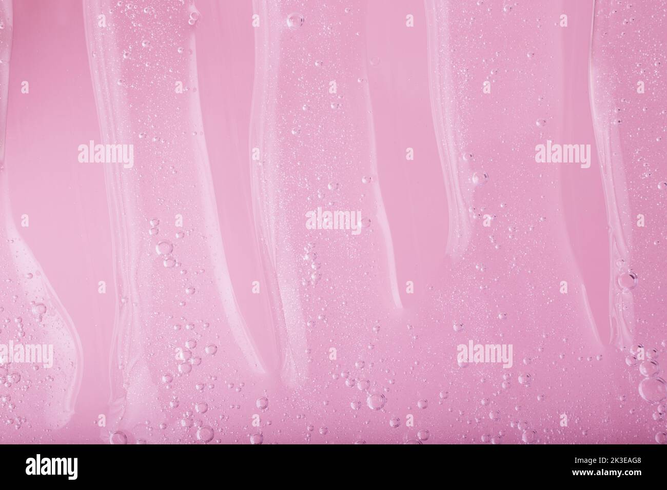 Macro photography of bubbly smear on raspberry pink background Stock ...