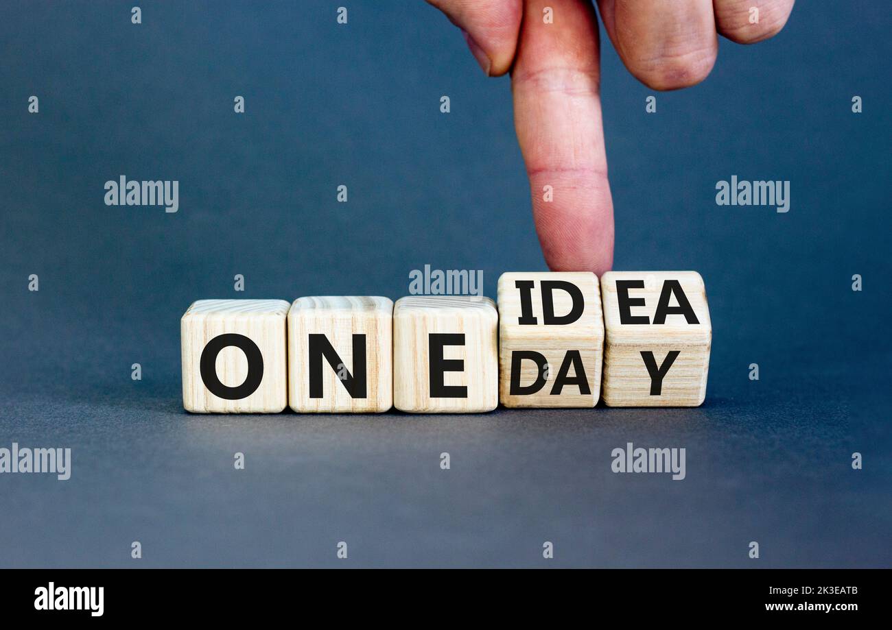 One day and idea symbol. Concept words One day and One idea on wooden ...