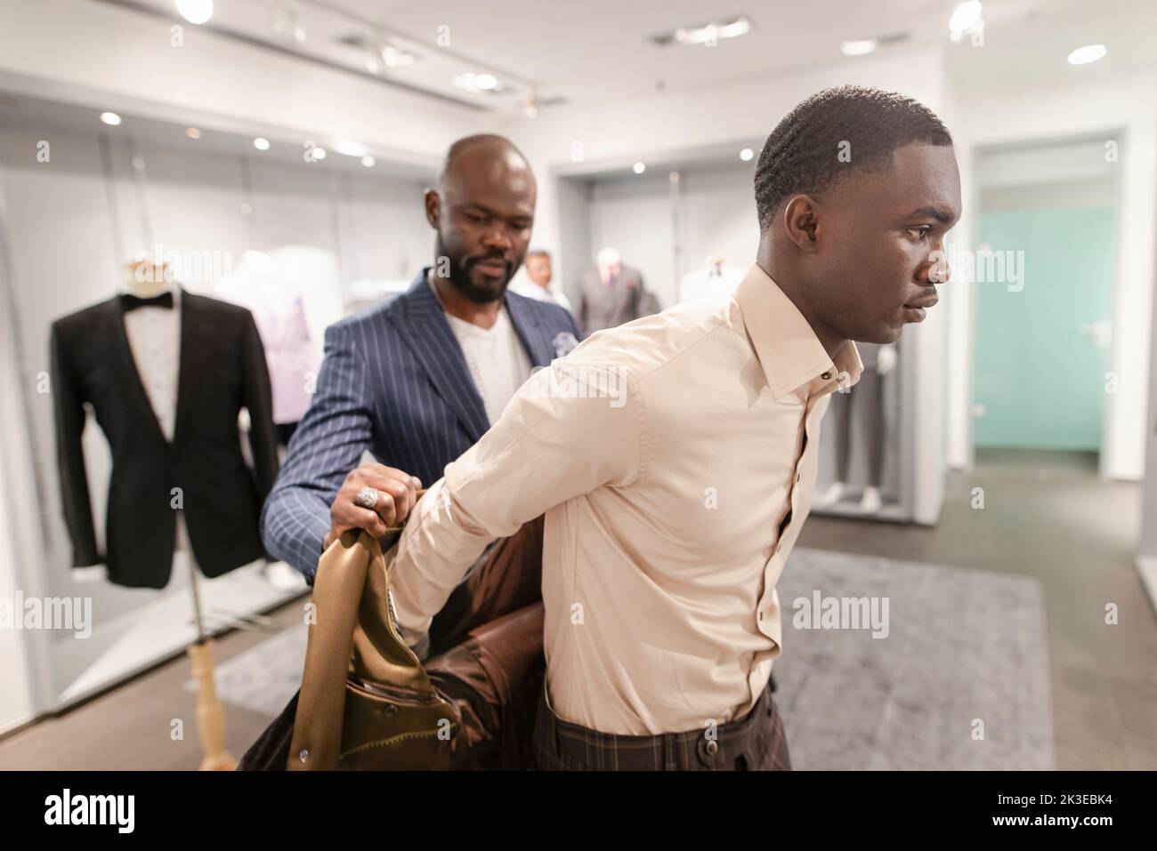 Man trying on a suit shop hi-res stock photography and images - Alamy