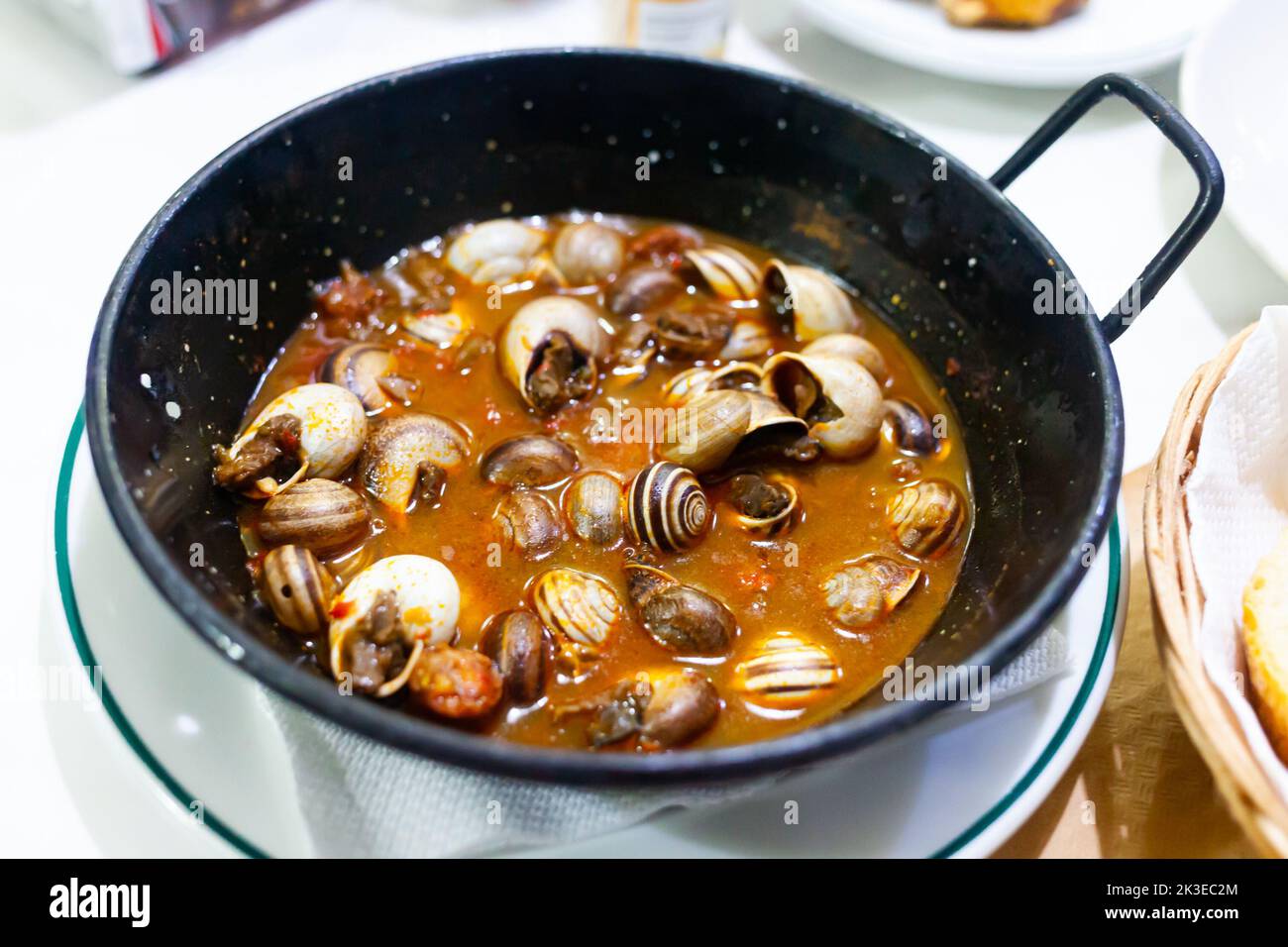 Picture of tasty baked in sauce snails in pan Stock Photo - Alamy