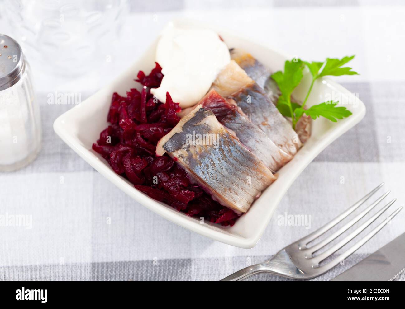 Pieces of herring with beetroot served on plate Stock Photo - Alamy