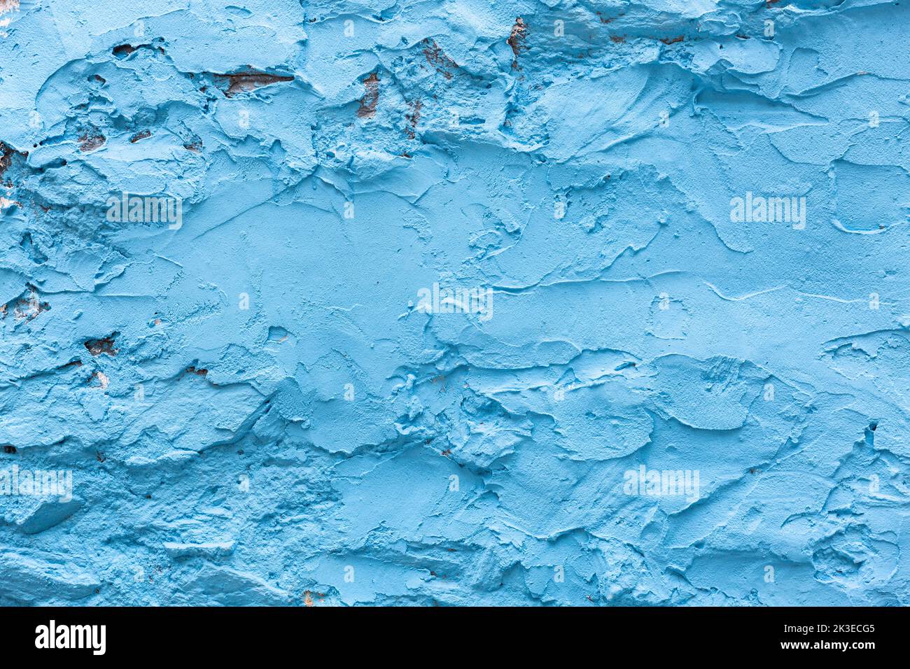 Detail of an old rough wall painted in blue. Surface to place a text ...