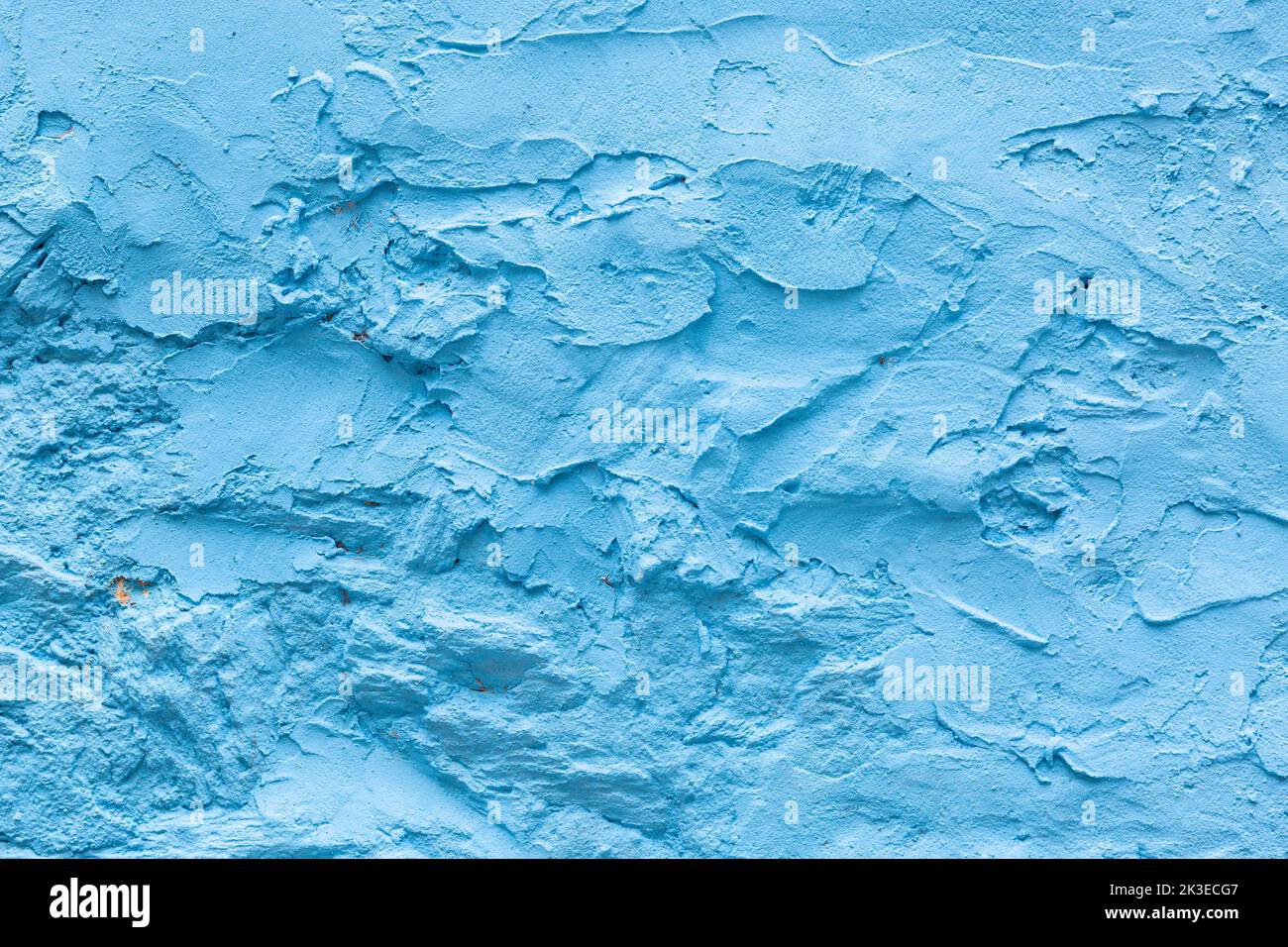 Detail of an old rough wall painted in blue. Surface to place a text ...