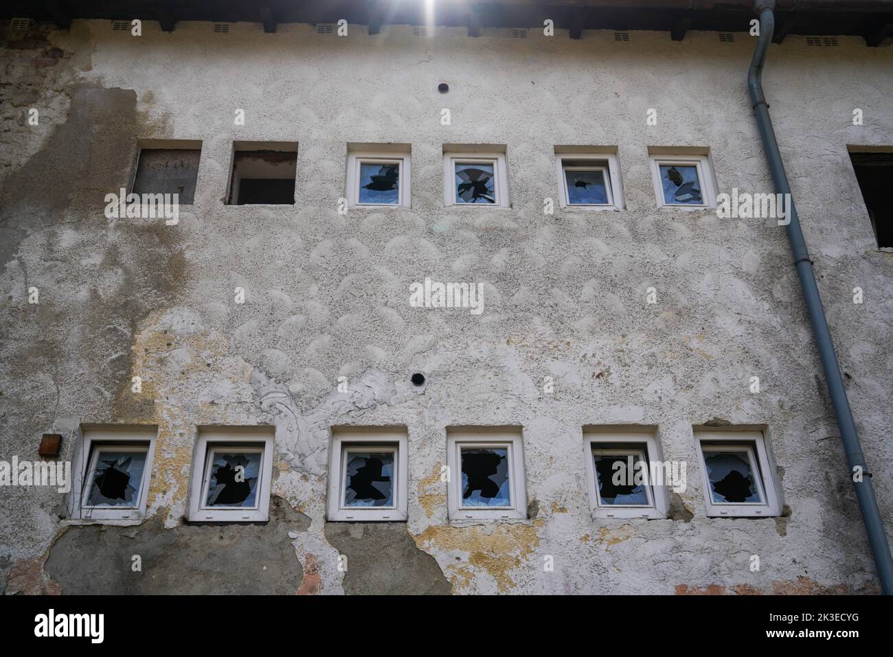 Broken, smashed window glass on an uninhabited building in Bavaria ...