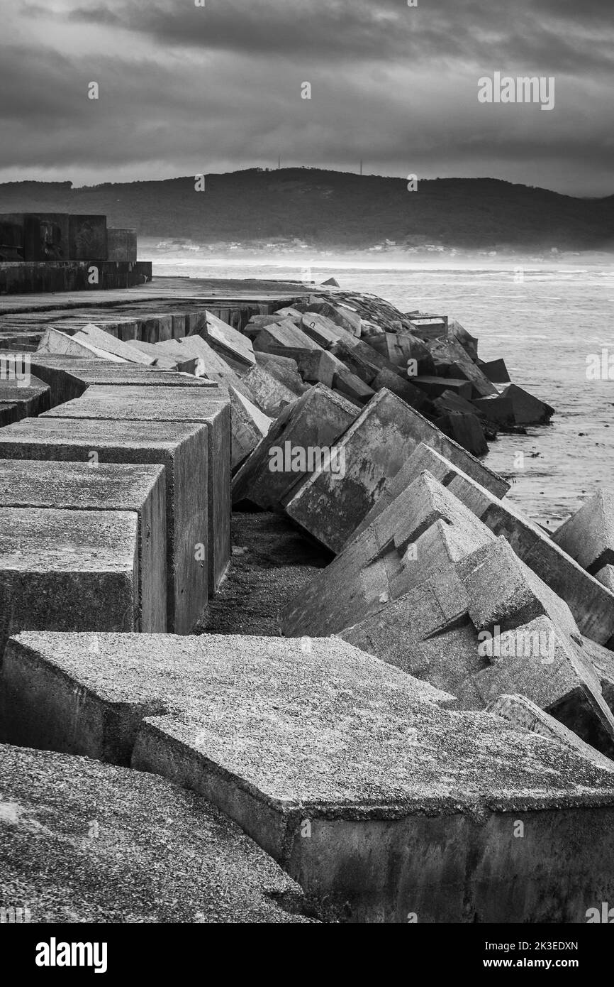 Concrete blocks in dock, Camelle, Galicia, Spain Stock Photo - Alamy
