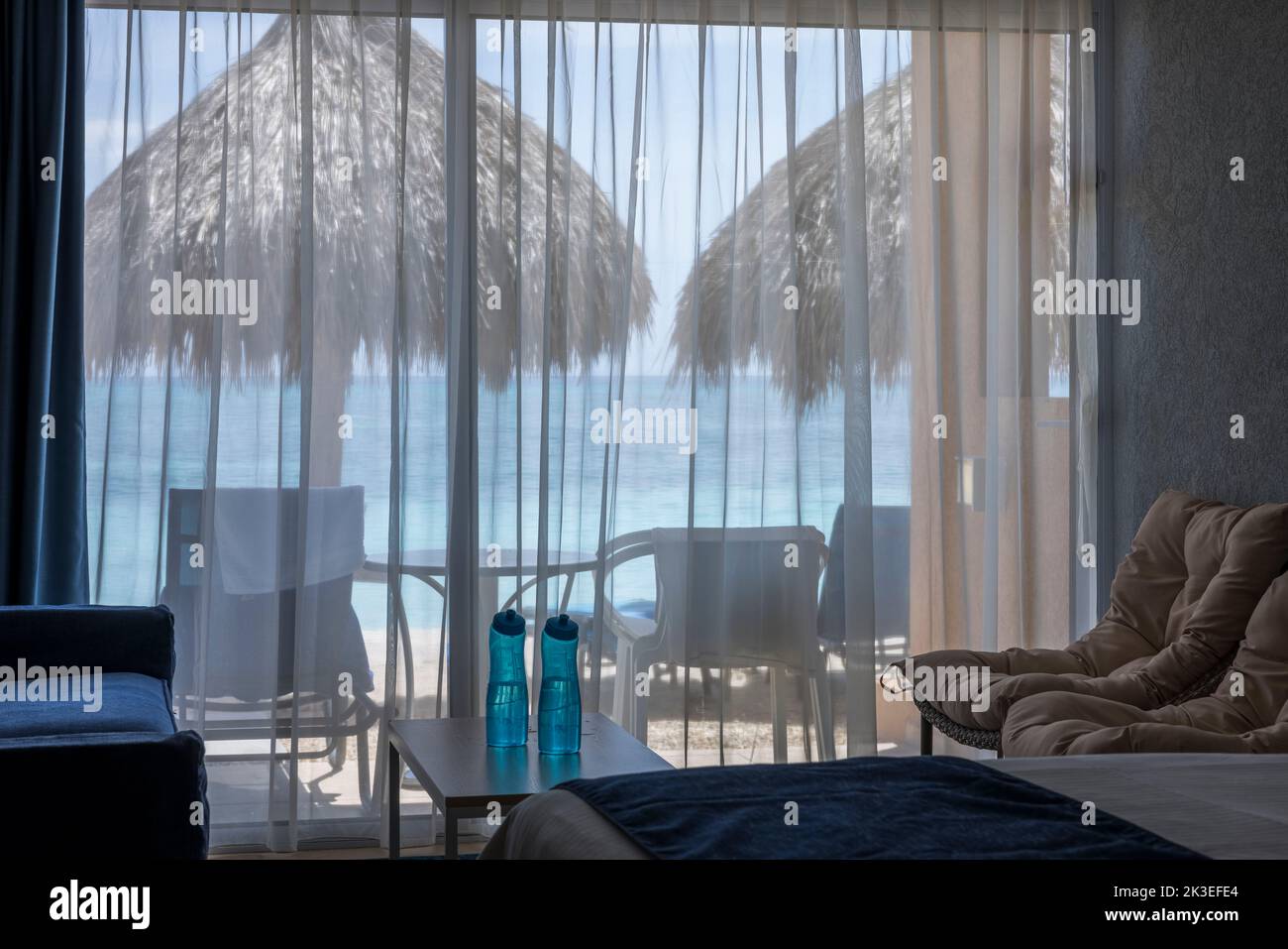 Beautiful view of Atlantic ocean through window of hotel room. Aruba ...