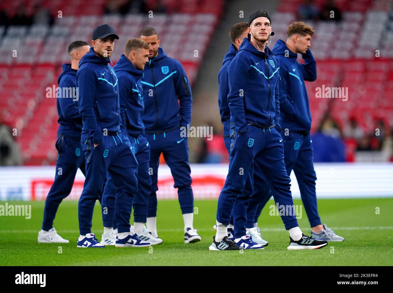 England's Jack Grealish (back left) and Declan Rice inspect the pitch ...