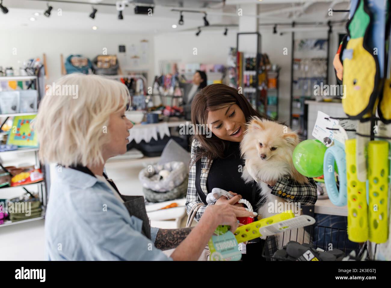 Female store worker hi-res stock photography and images - Alamy