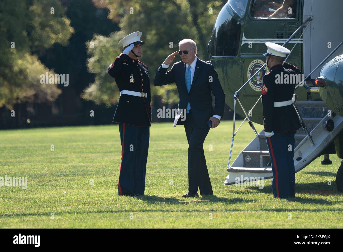 United States President Joe Biden salutes the Marine Guards as he ...