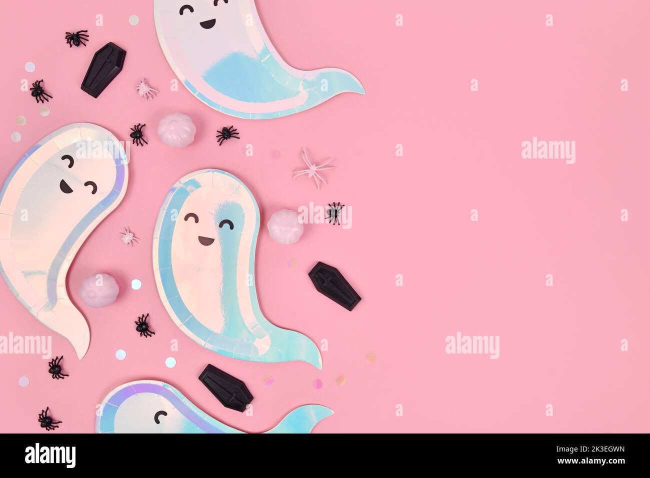 Cute pastel colored Halloween party flat lay with ghost shaped plates ...