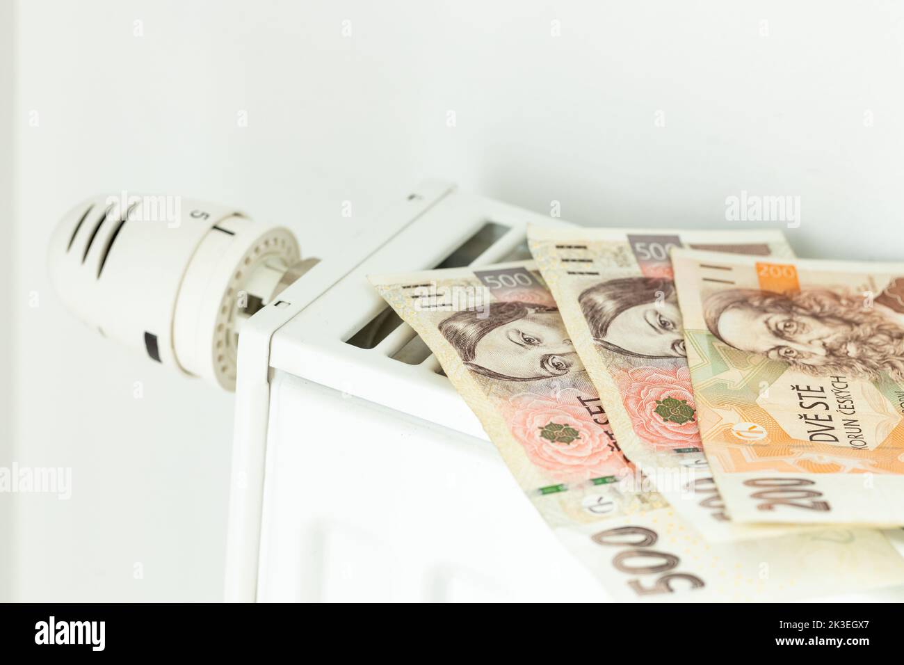 Czech money korun lying on the radiator, the concept of rising energy ...