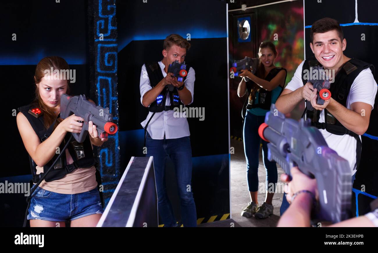 Young people playing laser tag Stock Photo - Alamy