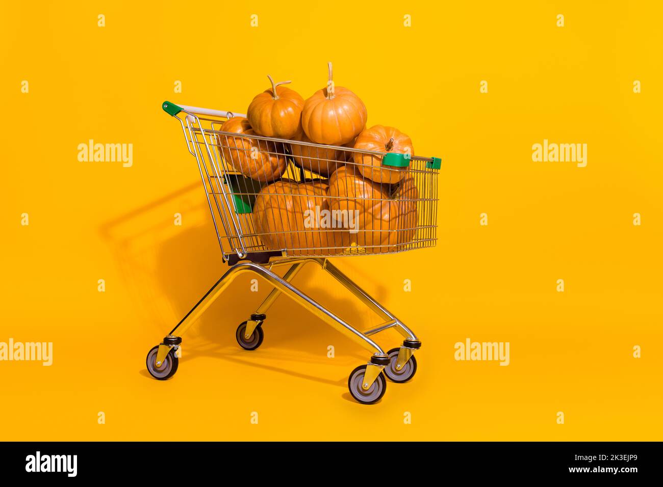 Full body portrait of supermarket trolley full pile stack pumpkin ...