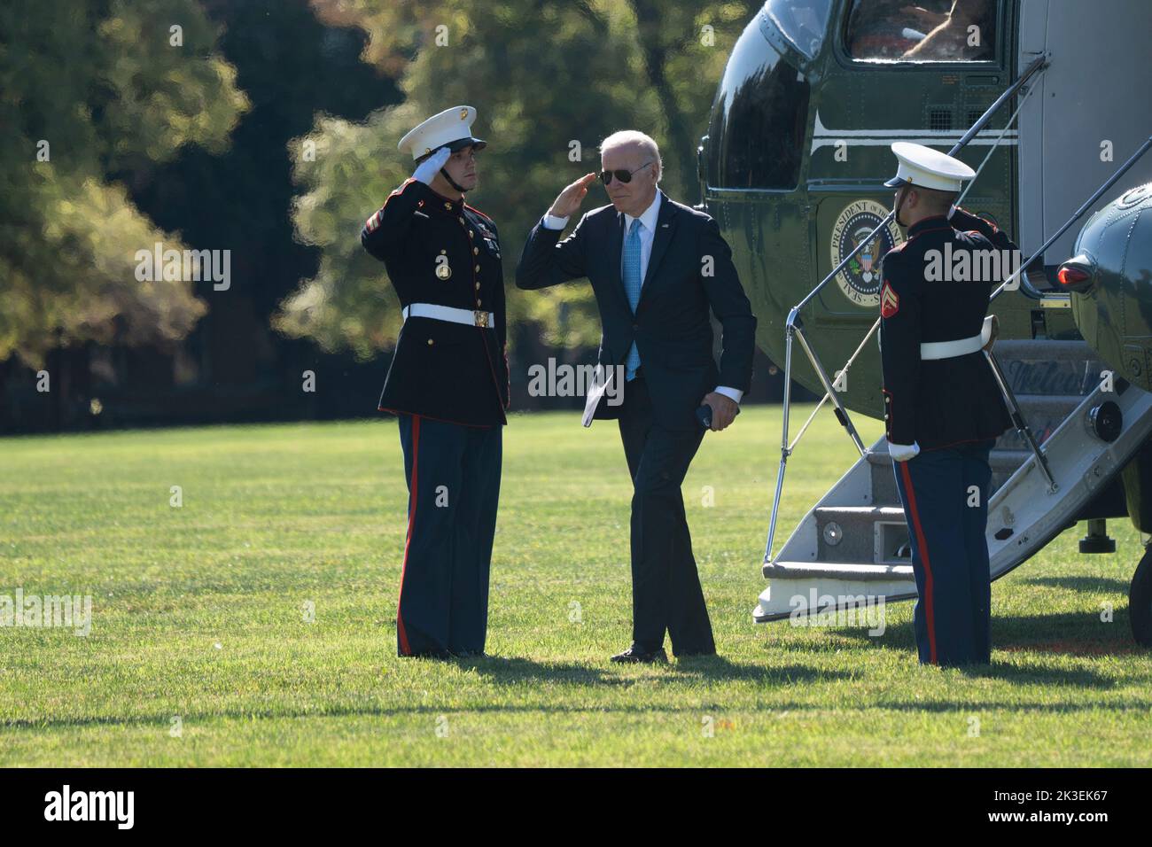 United States President Joe Biden salutes the Marine Guards as he ...