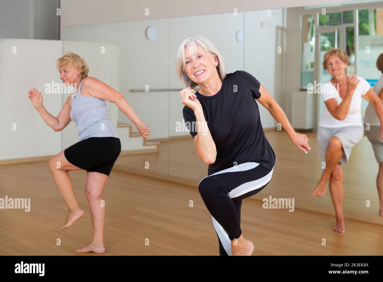 Mature women practice active dancing in the studio Stock Photo - Alamy