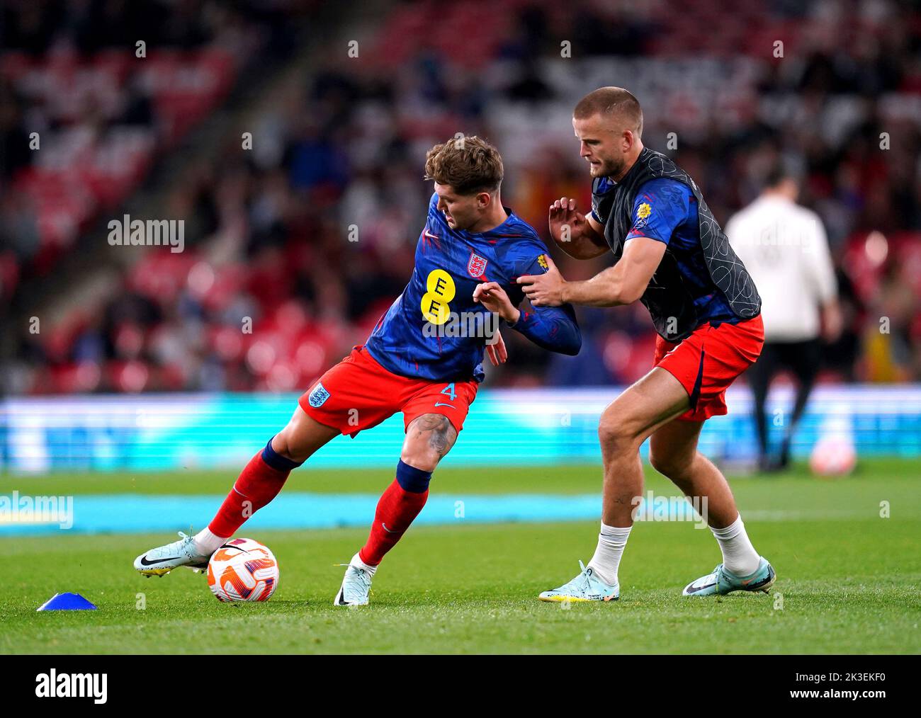 England's John Stones (left) and Eric Dier warm up ahead of the UEFA ...