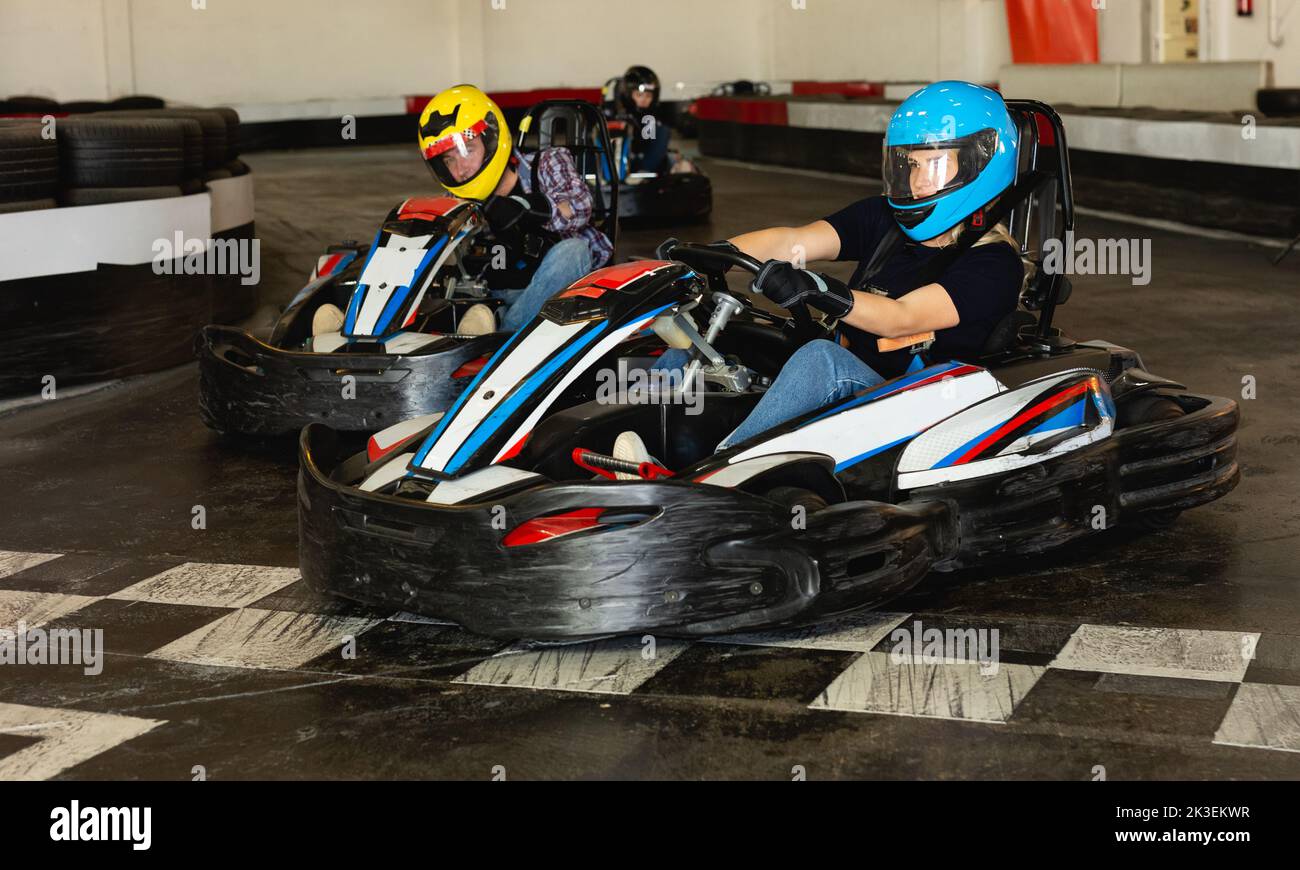 People driving go-kart cars Stock Photo - Alamy