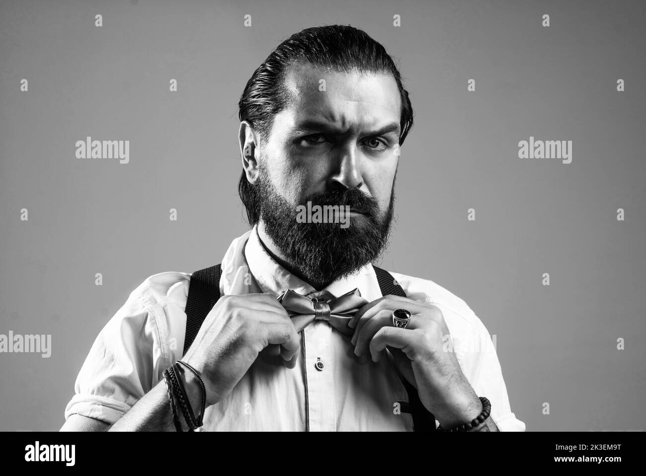 brutal bearded man with moustache wear suspenders and bow tie, retro ...