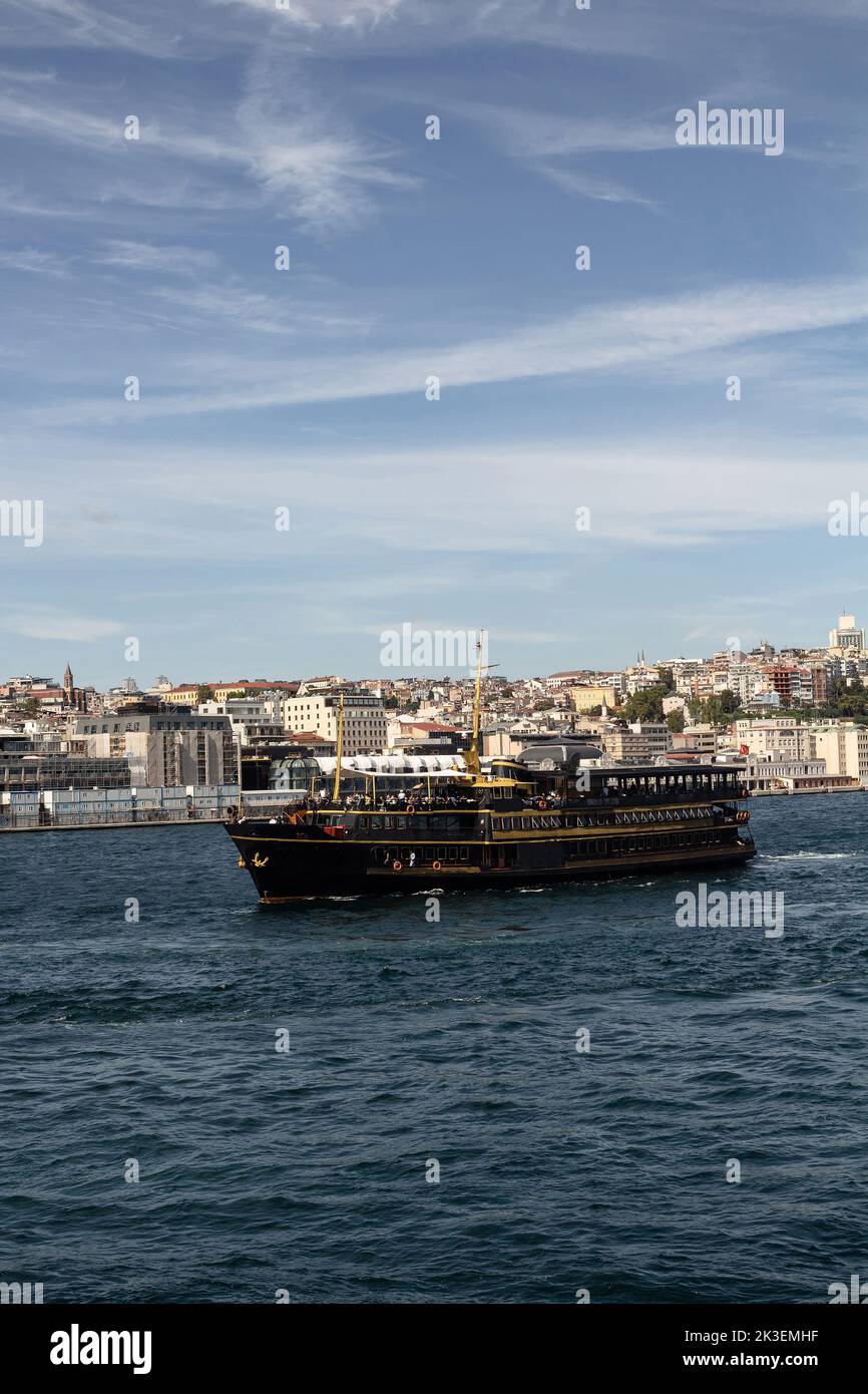 View of a traditional tour boat on Bosphorus in Istanbul. European side ...