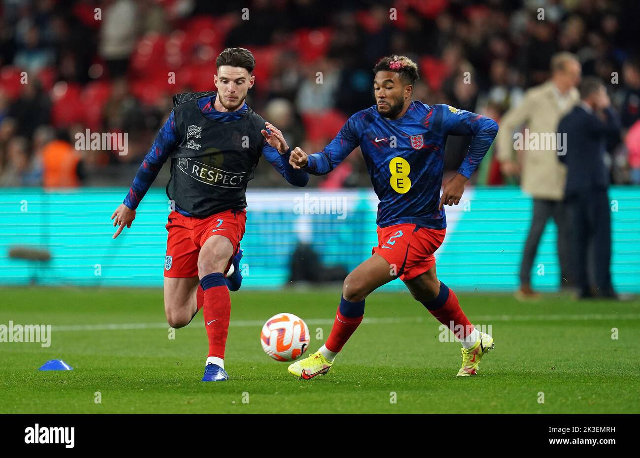 England's Declan Rice and Reece James (right) warm up on the pitch ...