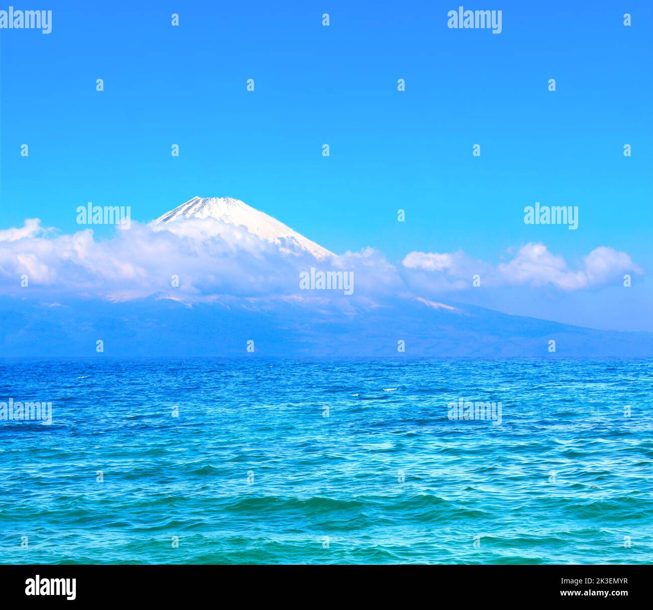 Sacred Mount Fuji in clouds on blue sky background, Japan. Beautiful ...