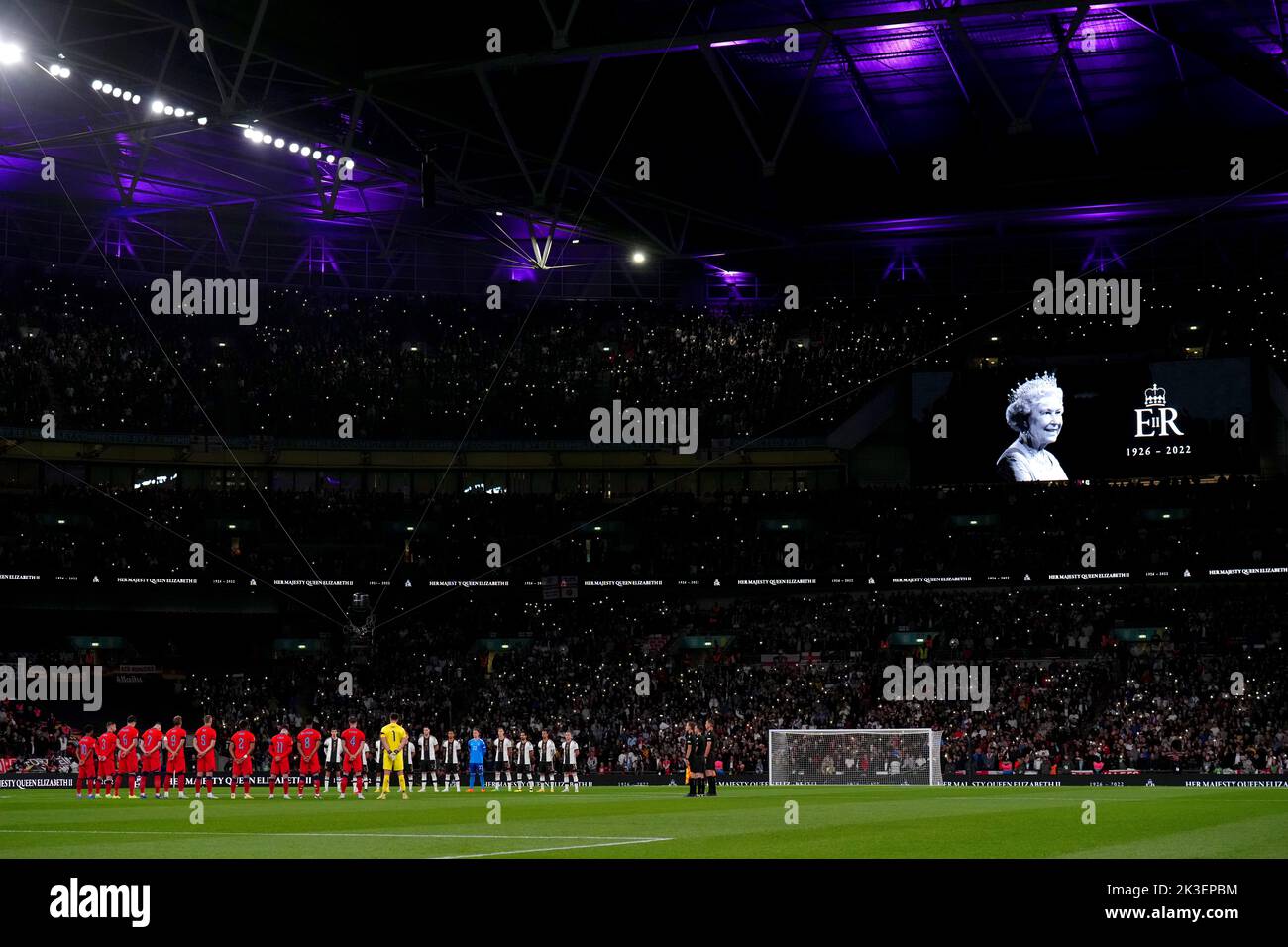 Players, fans and match officials observe a minute's silence in memory ...