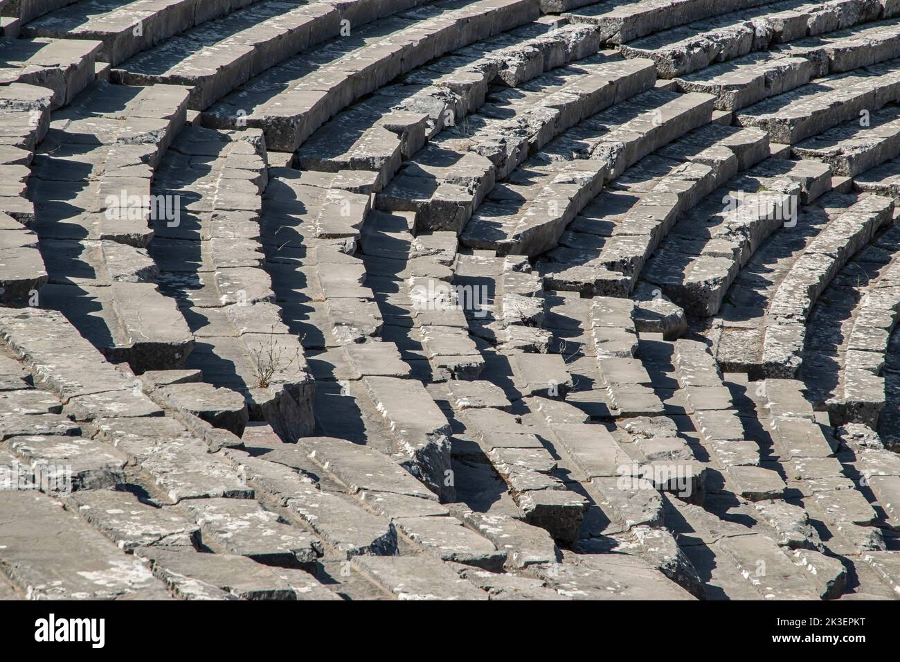 Stone seats of an ancient Greek theater in sunny day Stock Photo - Alamy