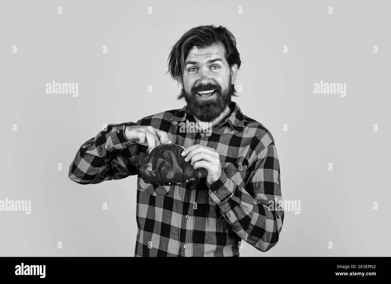 Smiling man holding red Black and White Stock Photos & Images - Alamy