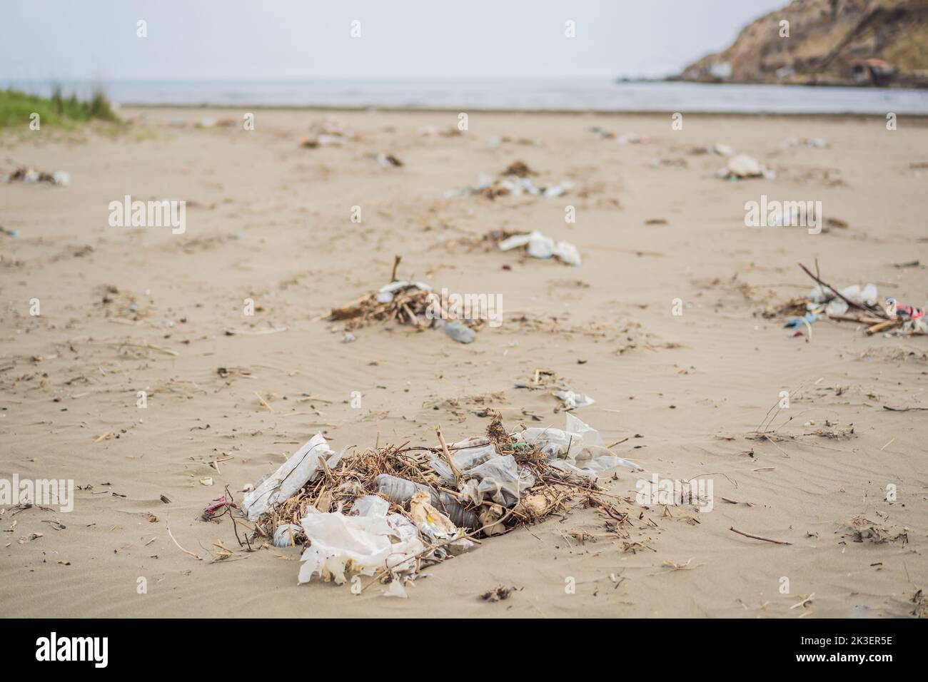 Spilled garbage on the beach. Empty used dirty plastic bottles ...