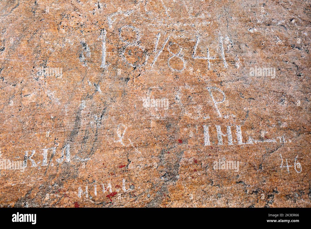 Carved name tags and dates on a rock in Katajanokanluoto islet in ...