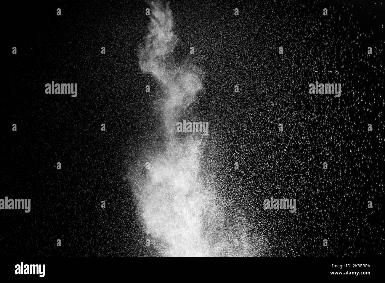 Curly white steam rising up and splashing water scattering in different ...