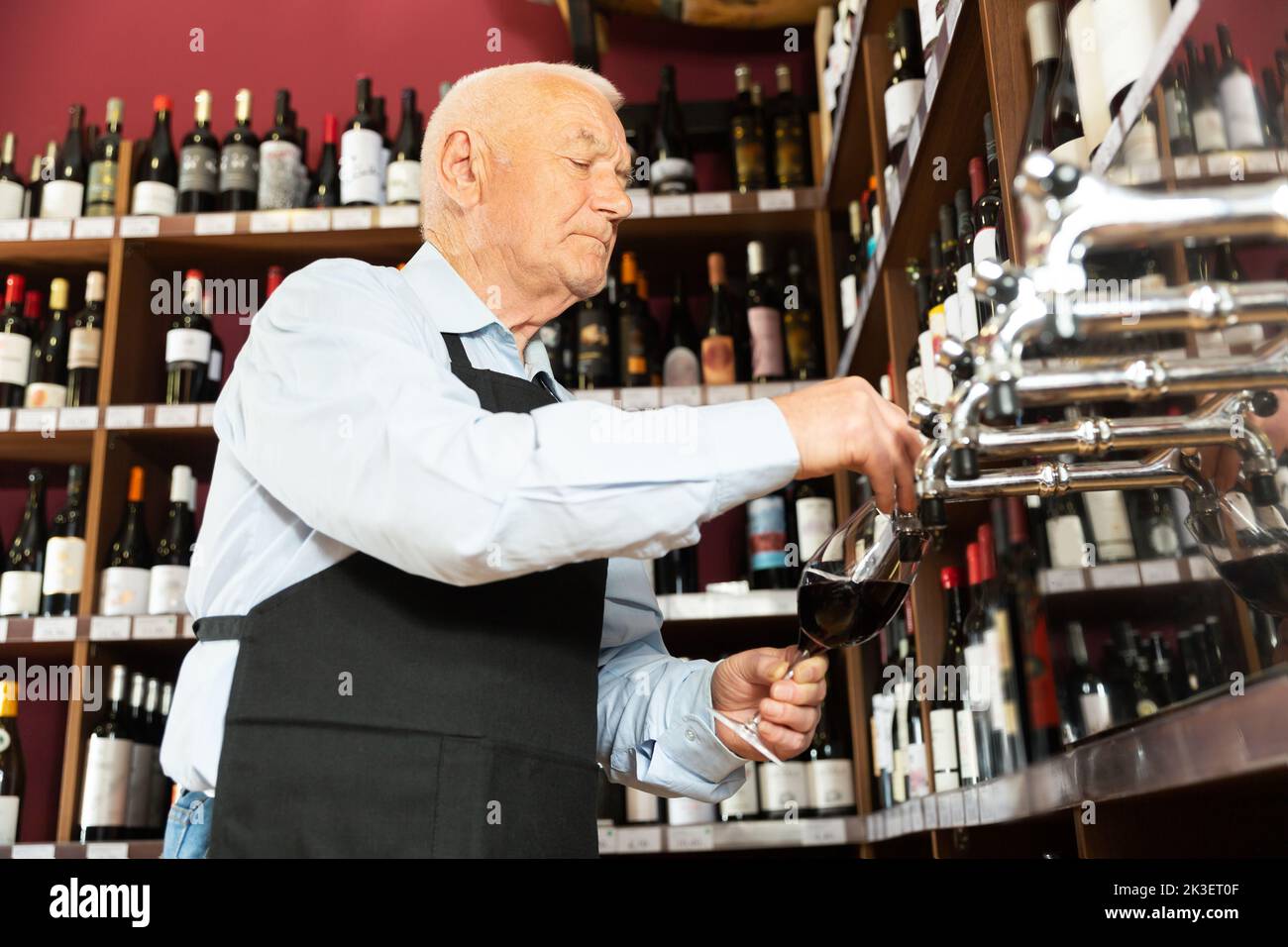 man professional sommelier pouring wine from wine column Stock Photo ...