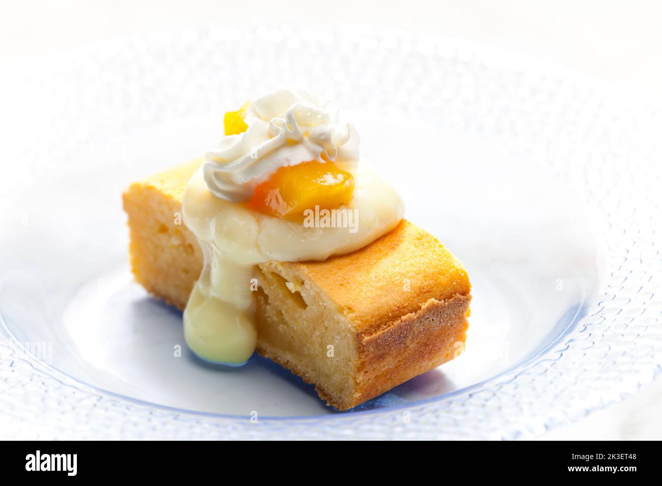 sponge cake with vanilla custard, peach and whipped cream Stock Photo ...