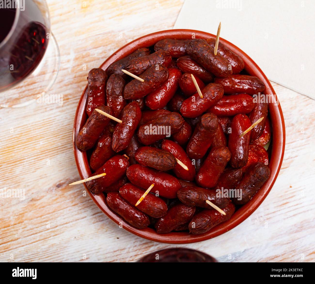 Grilled mini sausages chistorra Stock Photo - Alamy