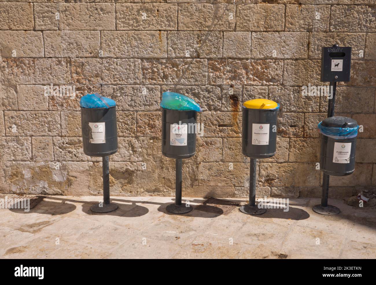 Recycling waste bins at the harbour and old town of Monopoli, Puglia ...