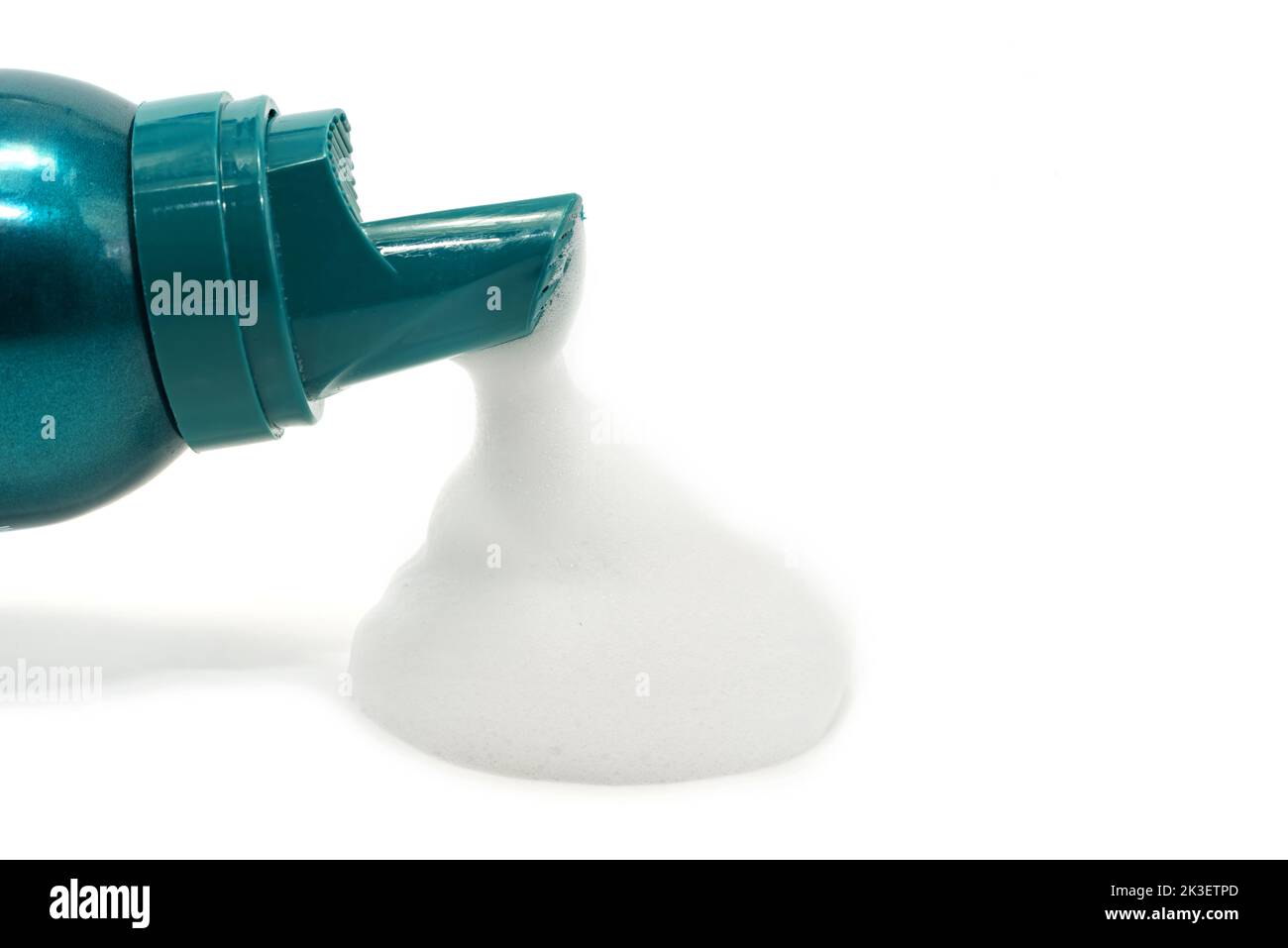 Shaving foam is squeezed out of a balloon on a white background. Lather ...