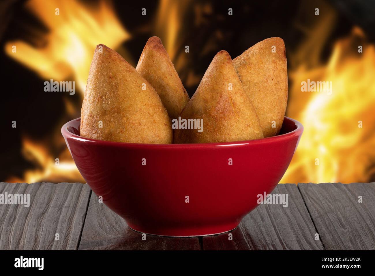 Coxinha. Traditional Brazilian snack. Background with defocused fire ...