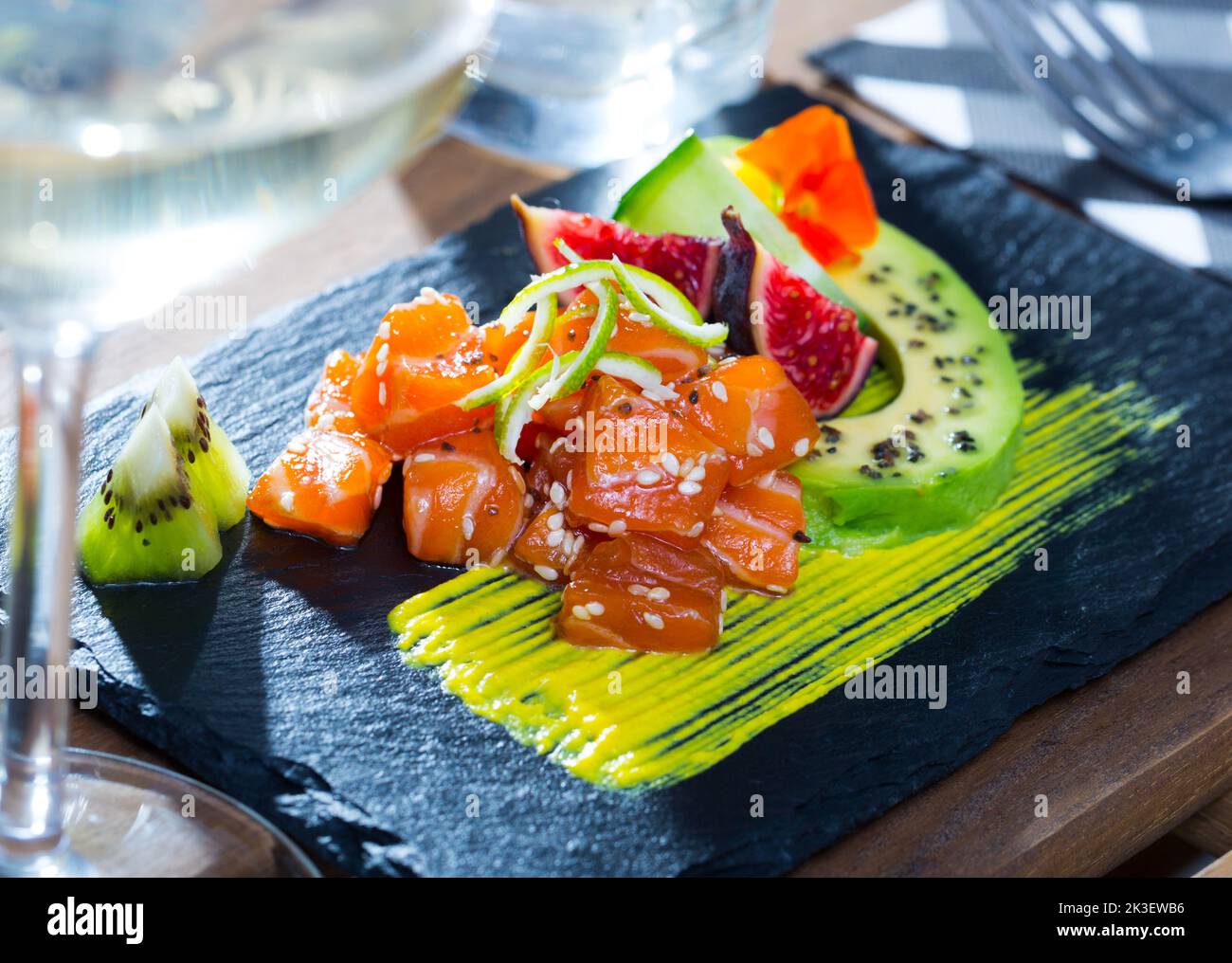 Slate of delicious tuna tartar with avocado Stock Photo - Alamy