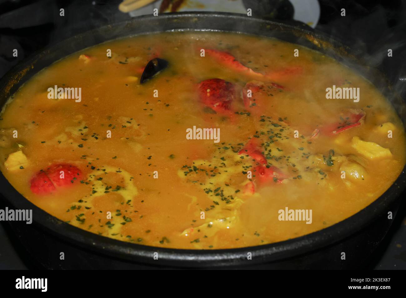 Lobster stew in metal casserole. lobster stew Stock Photo - Alamy