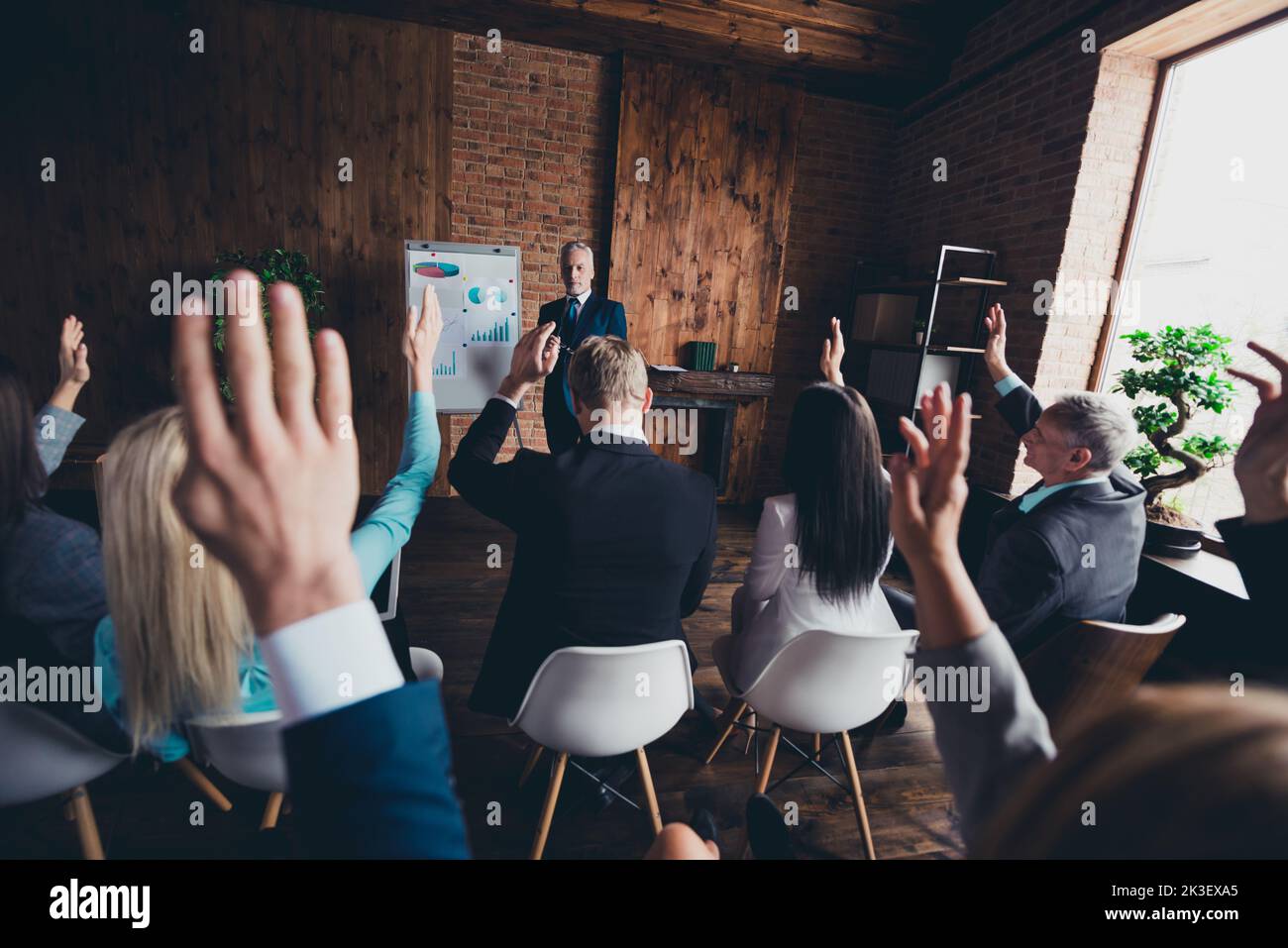 Photo of crowd business people sitting chair conference room raise arm ...