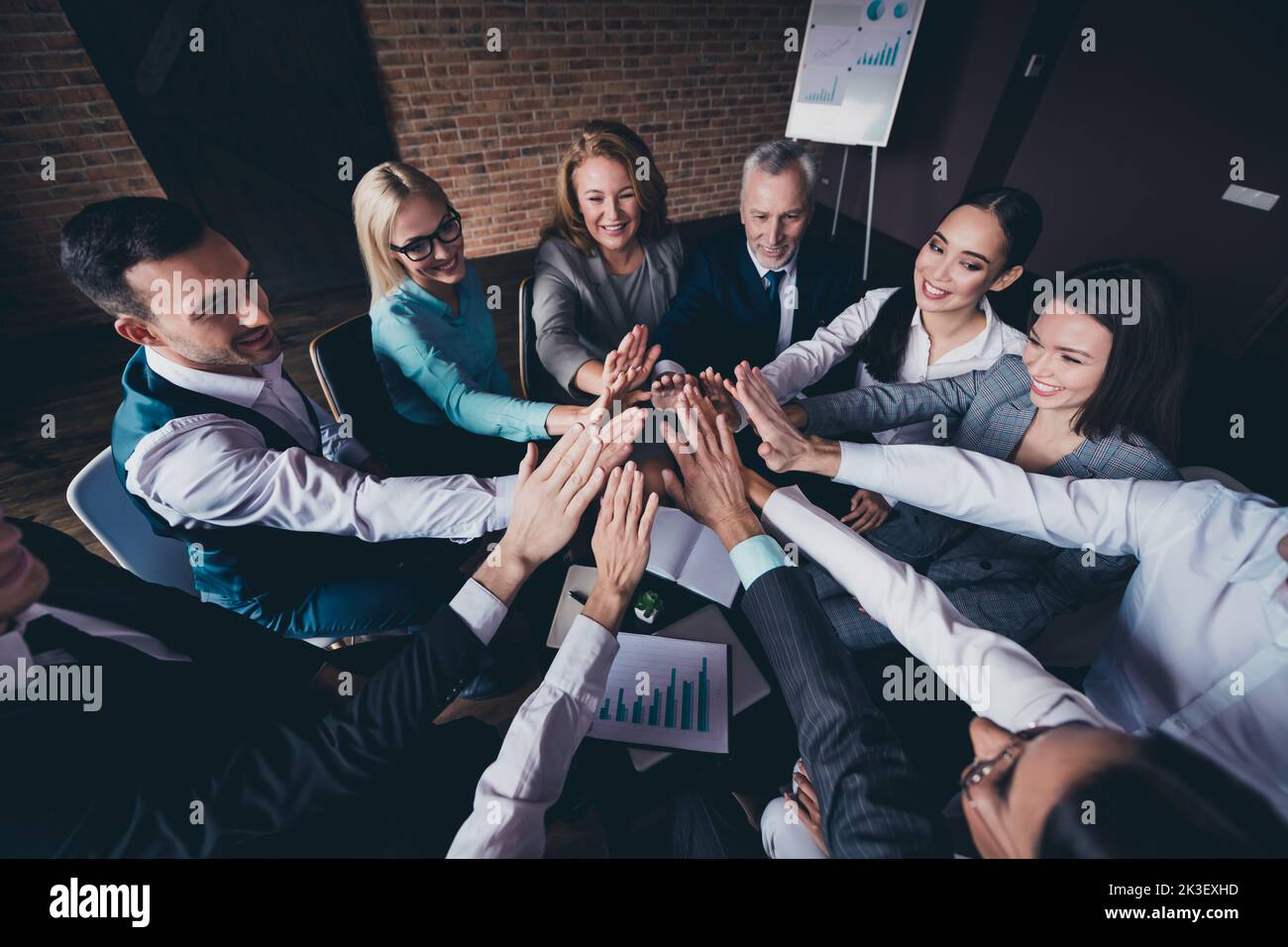 Portrait of successful business partners sitting chair hands clap give ...