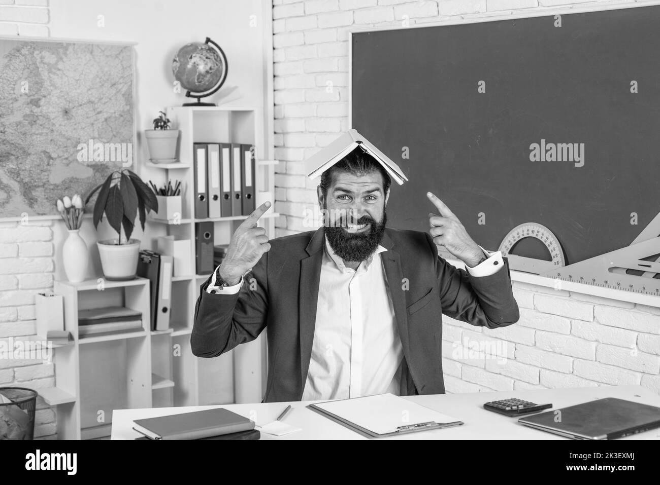 confused man with beard overworked with notebook. troubles in studying ...
