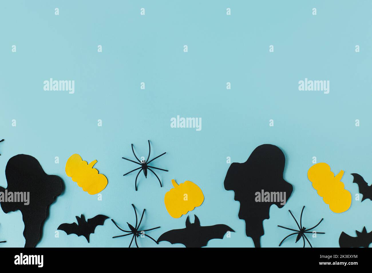 Happy Halloween. Black ghosts, spiders, bats and yellow pumpkins ...