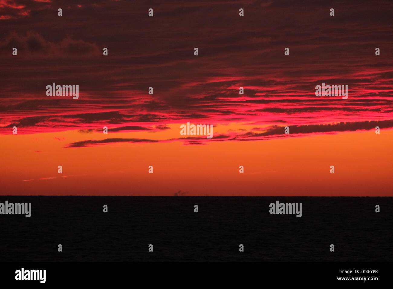 Red fire blood sunset with cloudy sky Stock Photo - Alamy