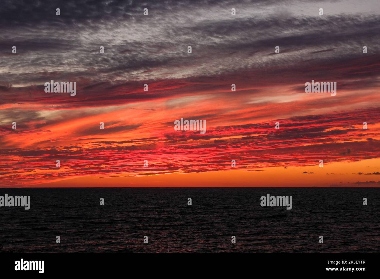 Red fire blood sunset with cloudy sky Stock Photo - Alamy