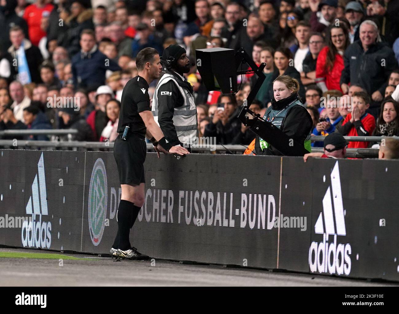 Referee Danny Makkelie checks the pitch side VAR monitor before ...